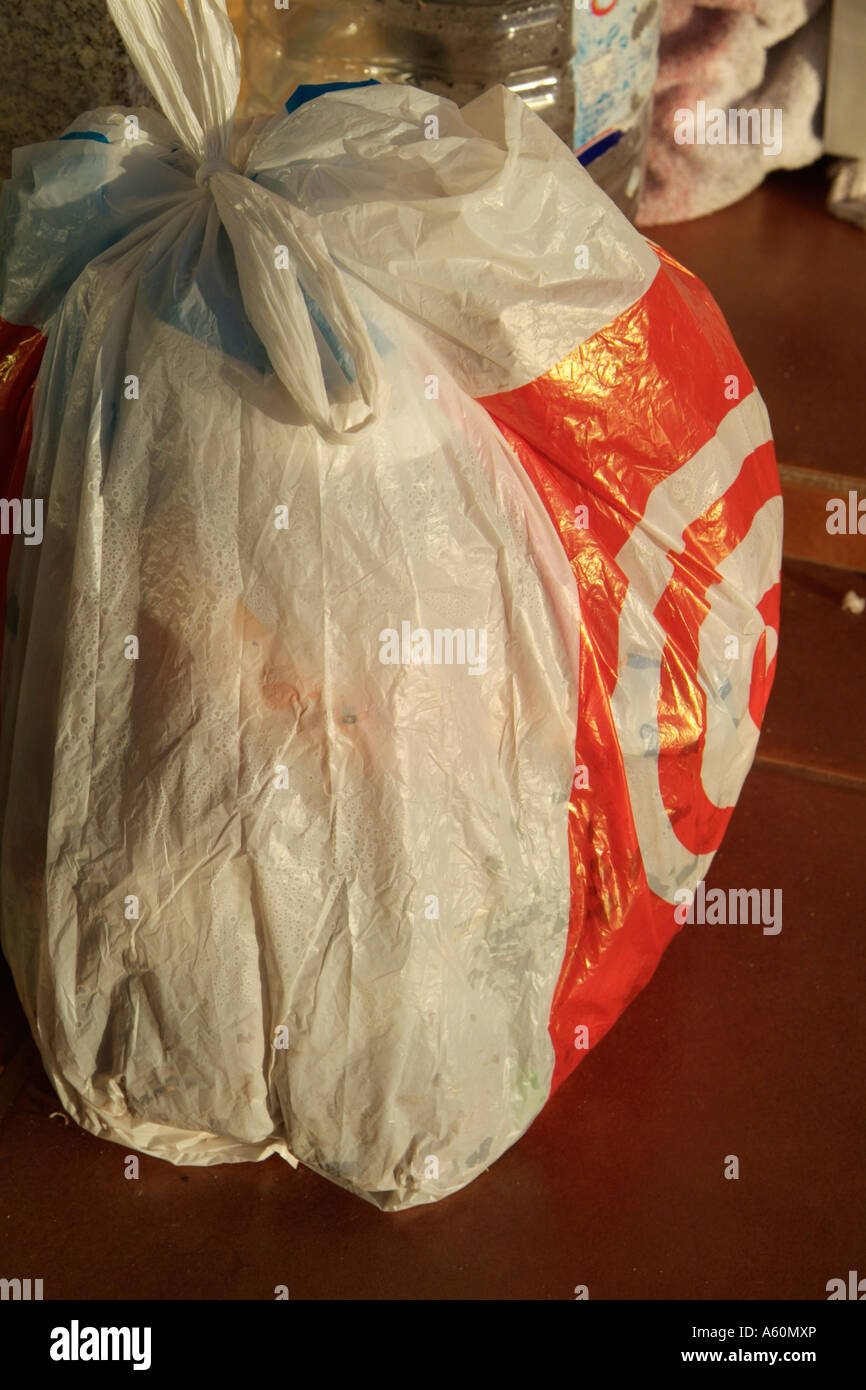 shopping plastic bag with rubish Stock Photo - Alamy