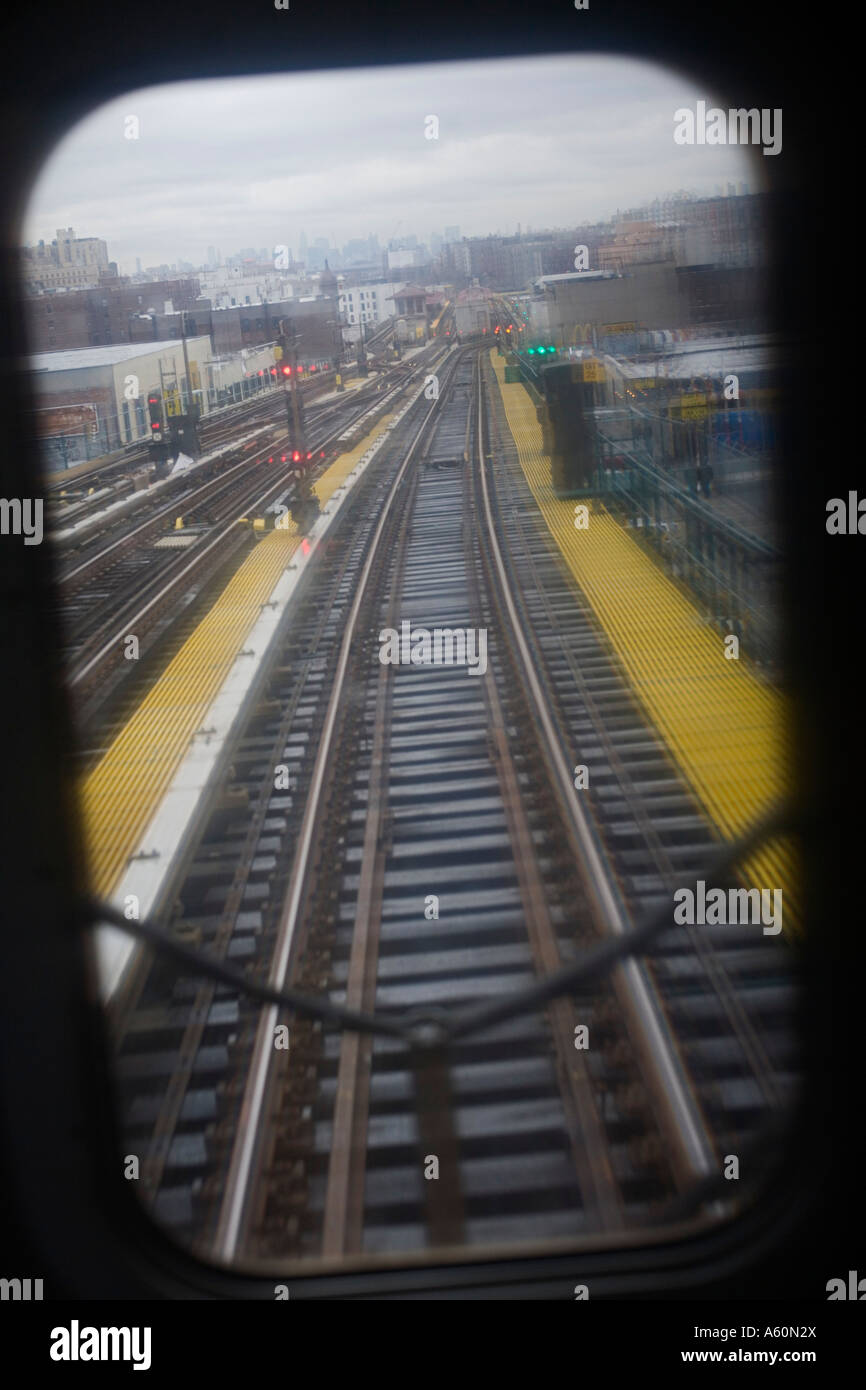 Subway track through train window Stock Photo - Alamy