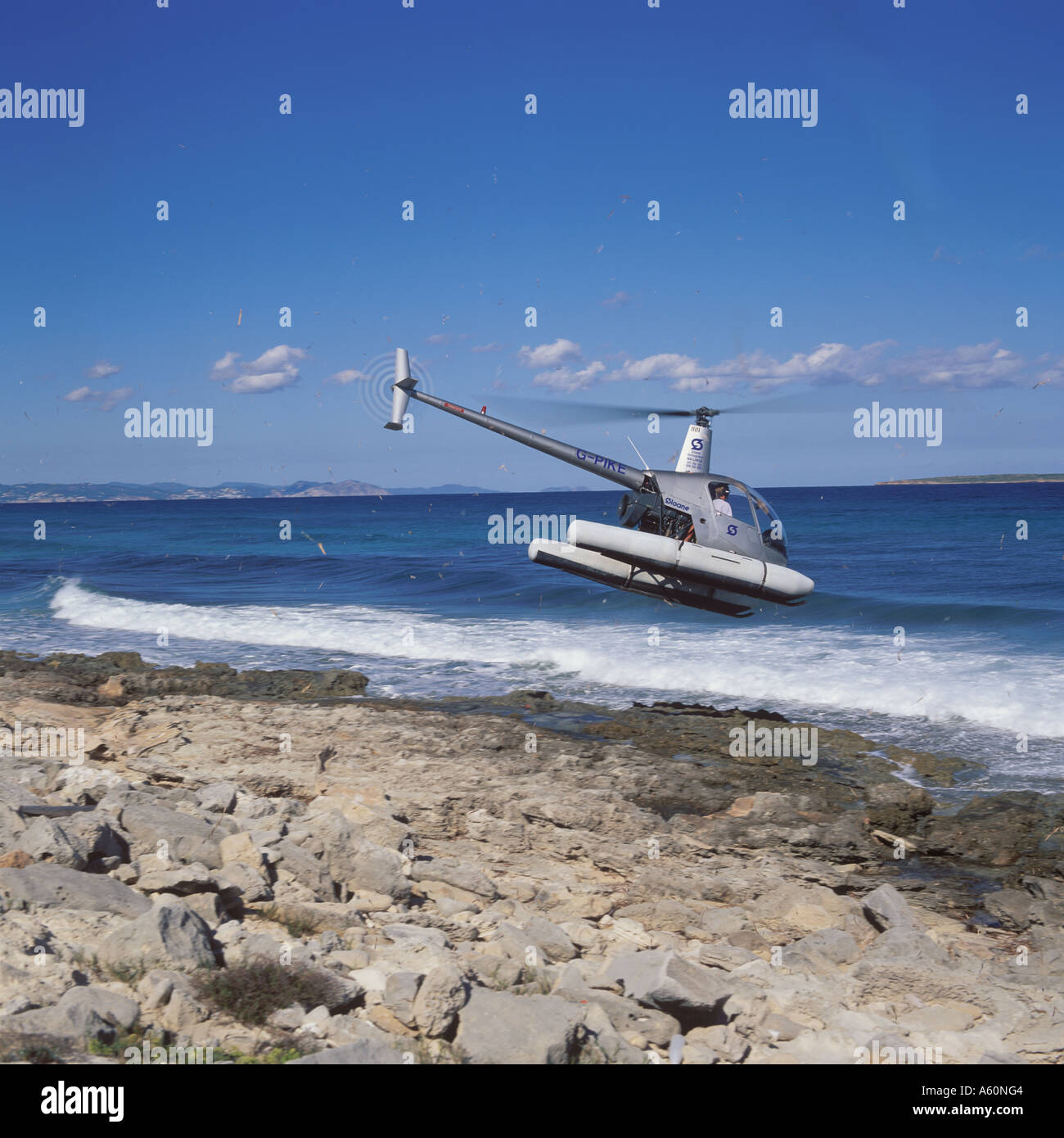 Robinson R22 helicopter operated by Sloane helicopters taking off from ...