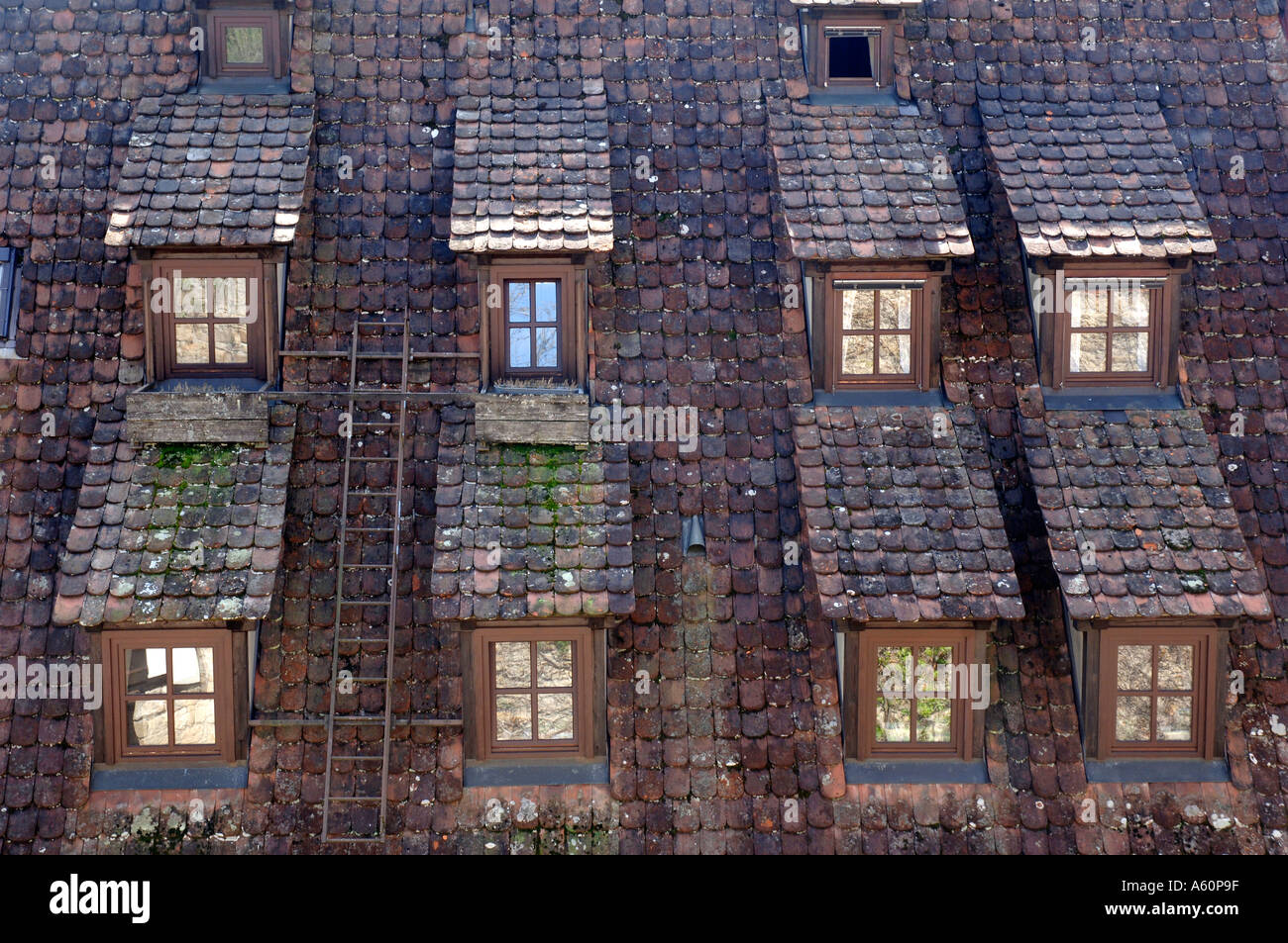 Upstairs windows in houses in Bebenhausen, Baden-Wurttemberg, Germany ...