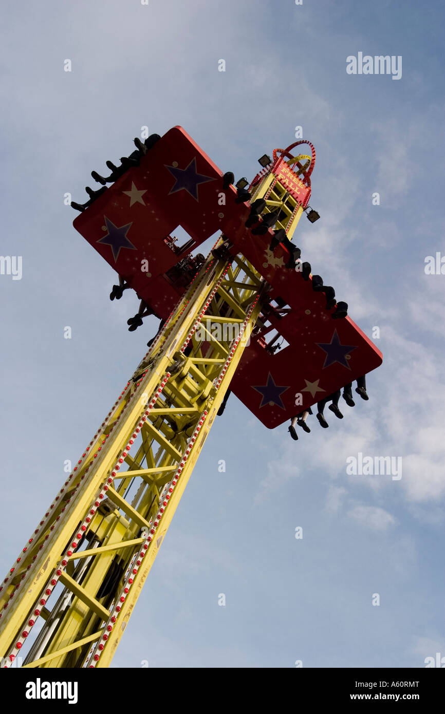 Legs dangling over side of fairground ride Stock Photo - Alamy