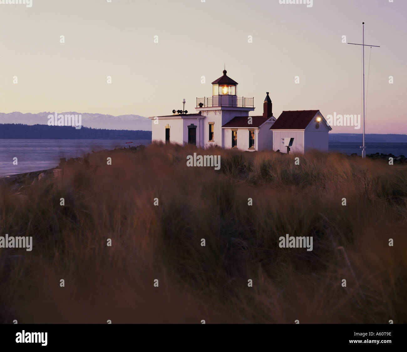 West Point Light Station on Puget Sound with the Olympic Mountain Range ...