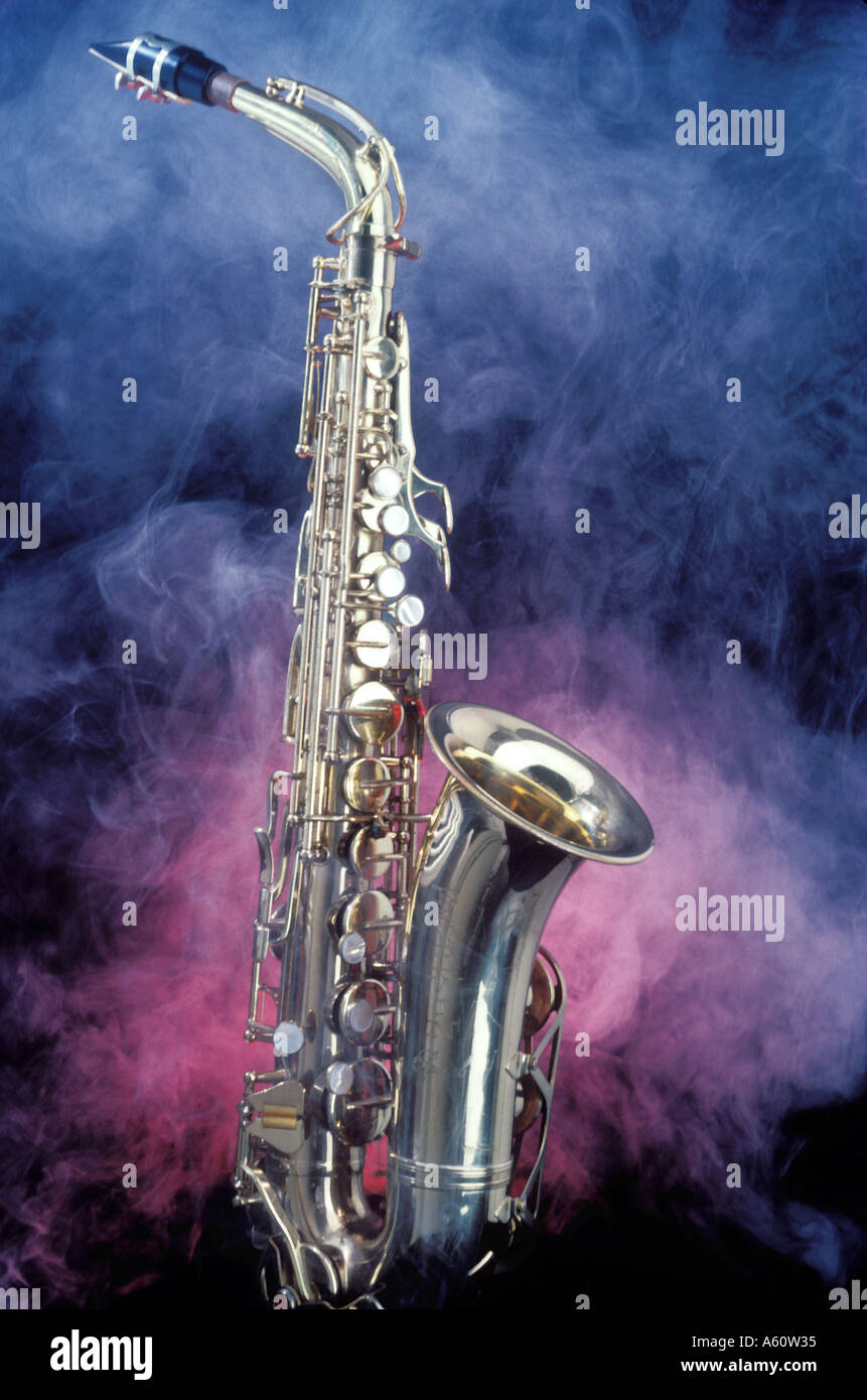 Saxophone in colored smoke Stock Photo - Alamy