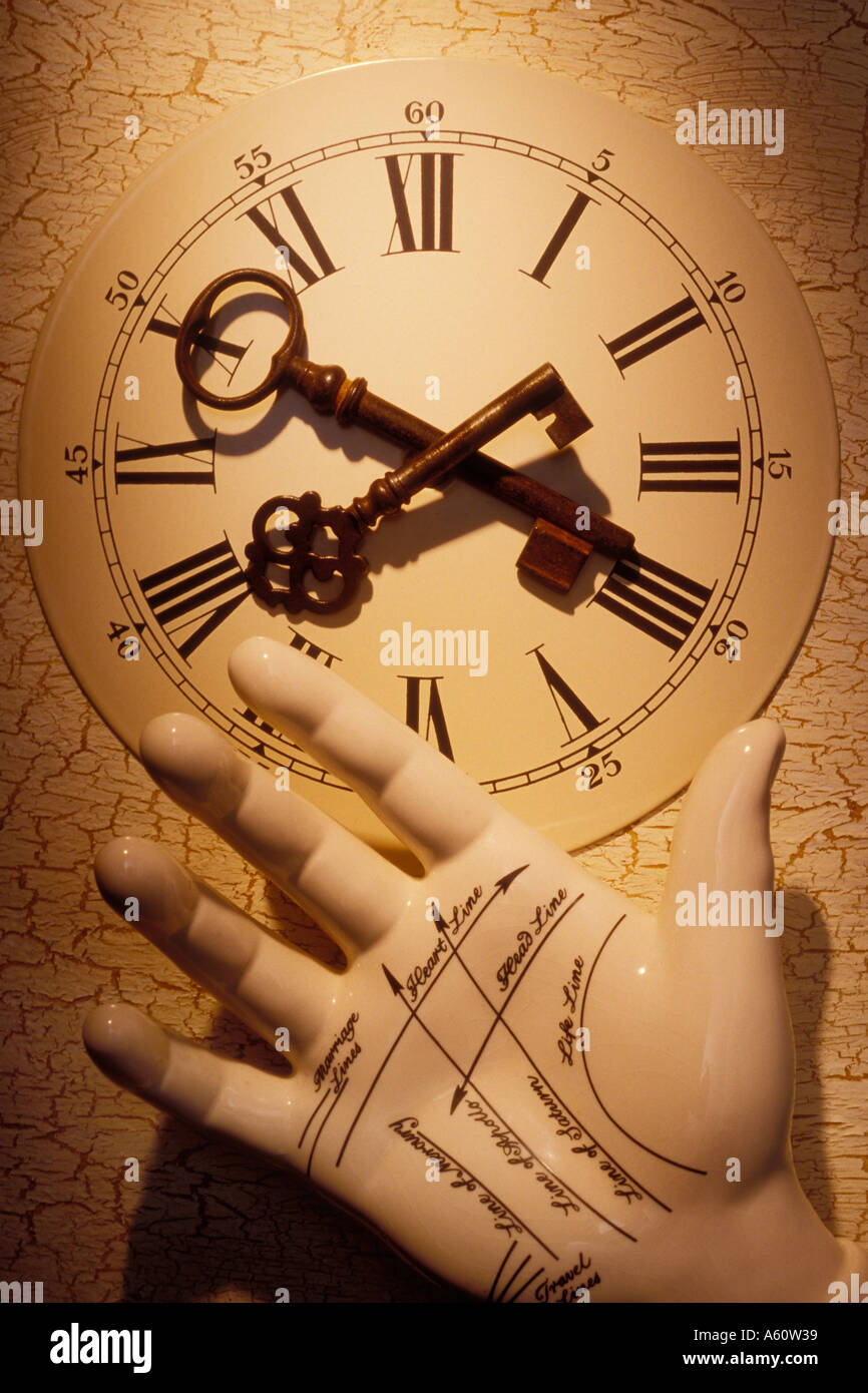 Two old skeleton keys on old clock face with fortune telling hand Stock ...