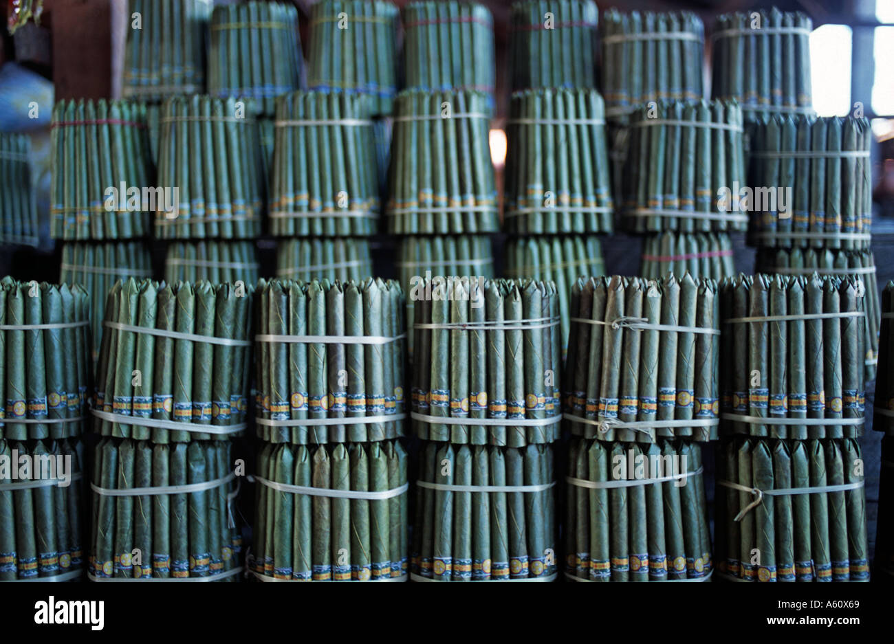 Stacks of home rolled Burmese cherooke cigarettes for sale at market as ...