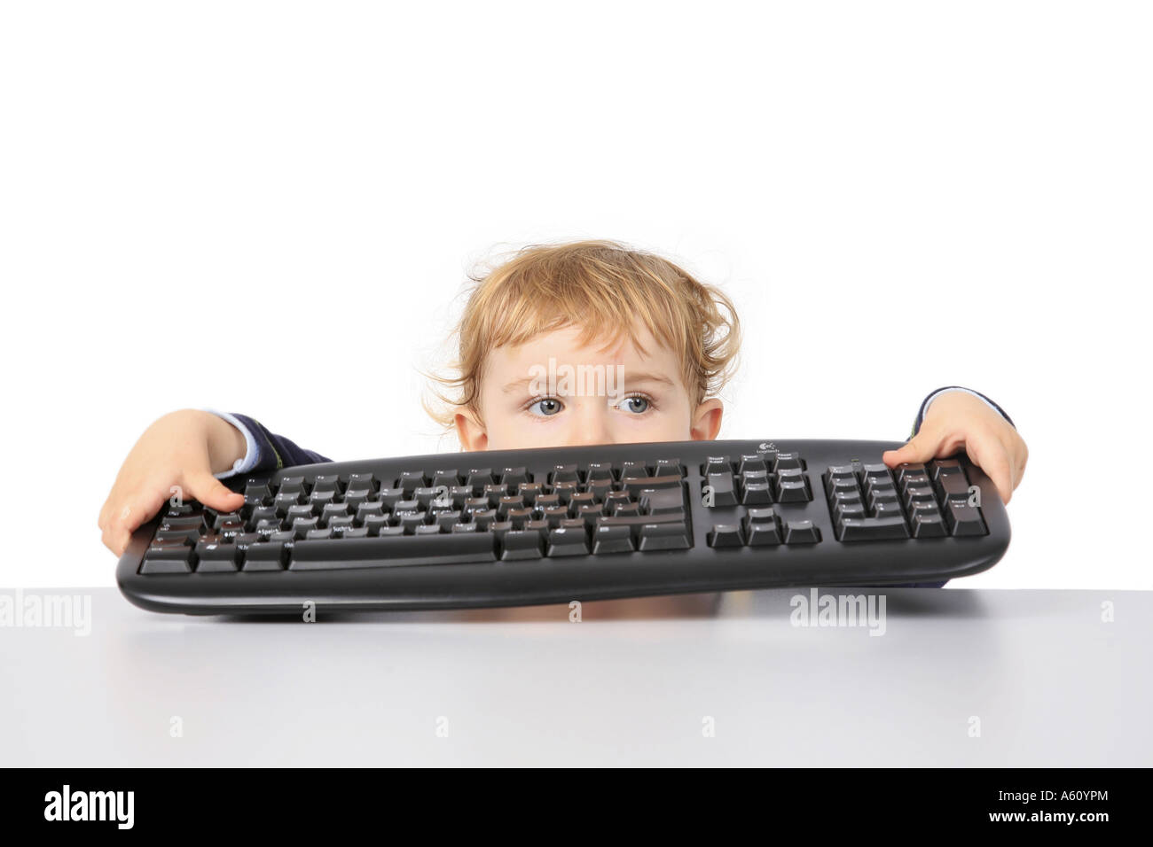 small boy with computer keyboard Stock Photo - Alamy