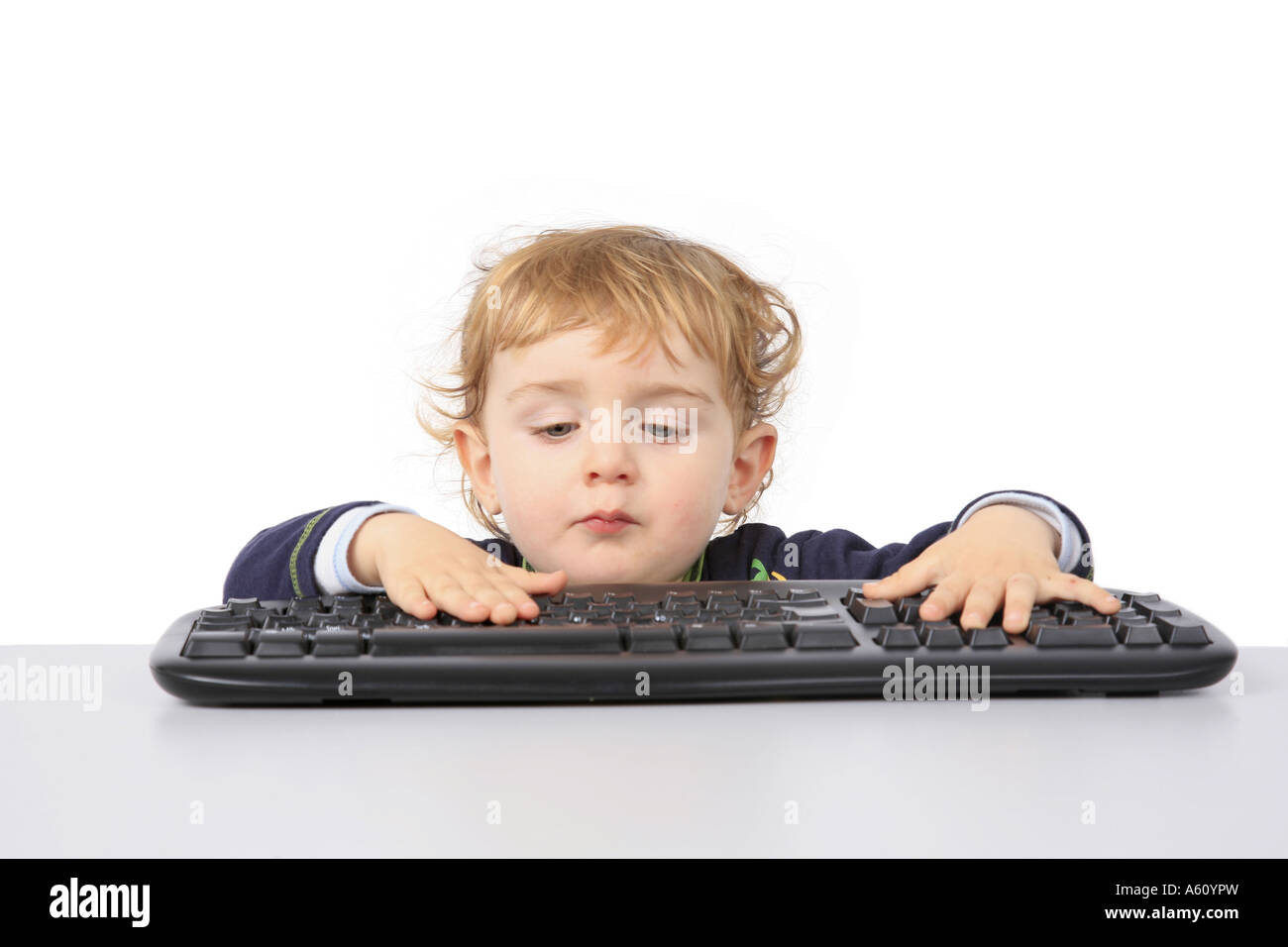 small boy with computer keyboard Stock Photo - Alamy