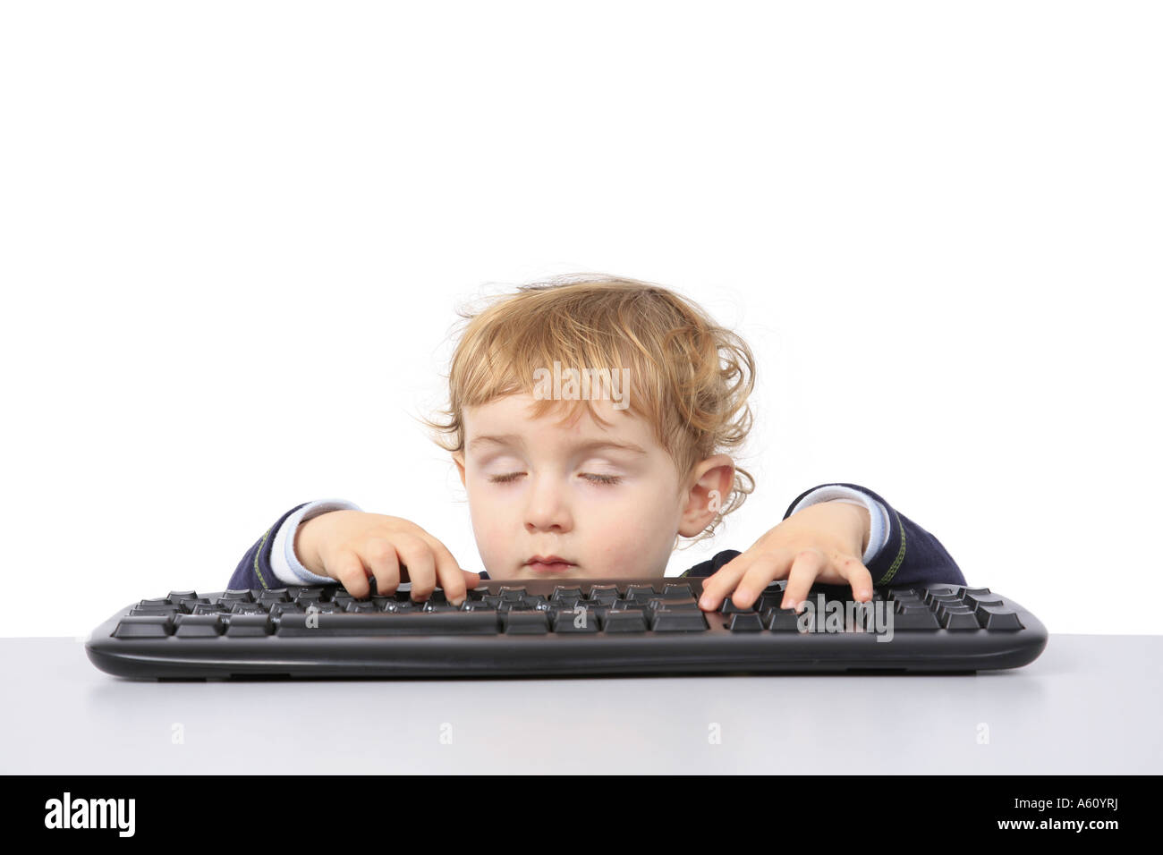 small boy with computer keyboard Stock Photo - Alamy