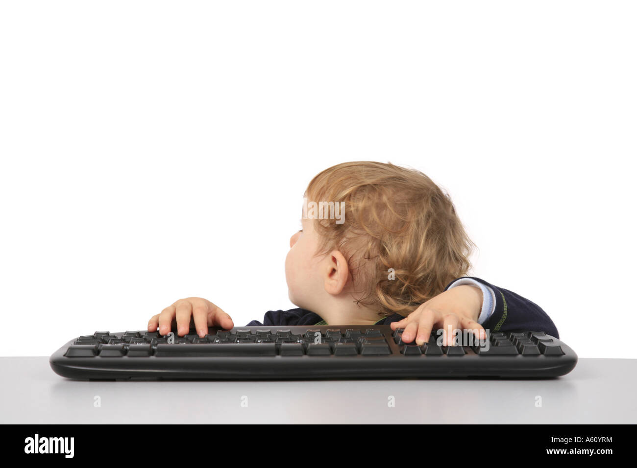 small boy with computer keyboard Stock Photo - Alamy
