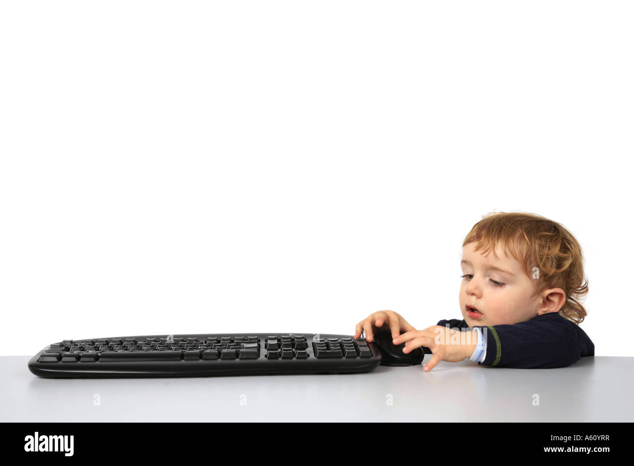small boy with computer keyboard Stock Photo - Alamy