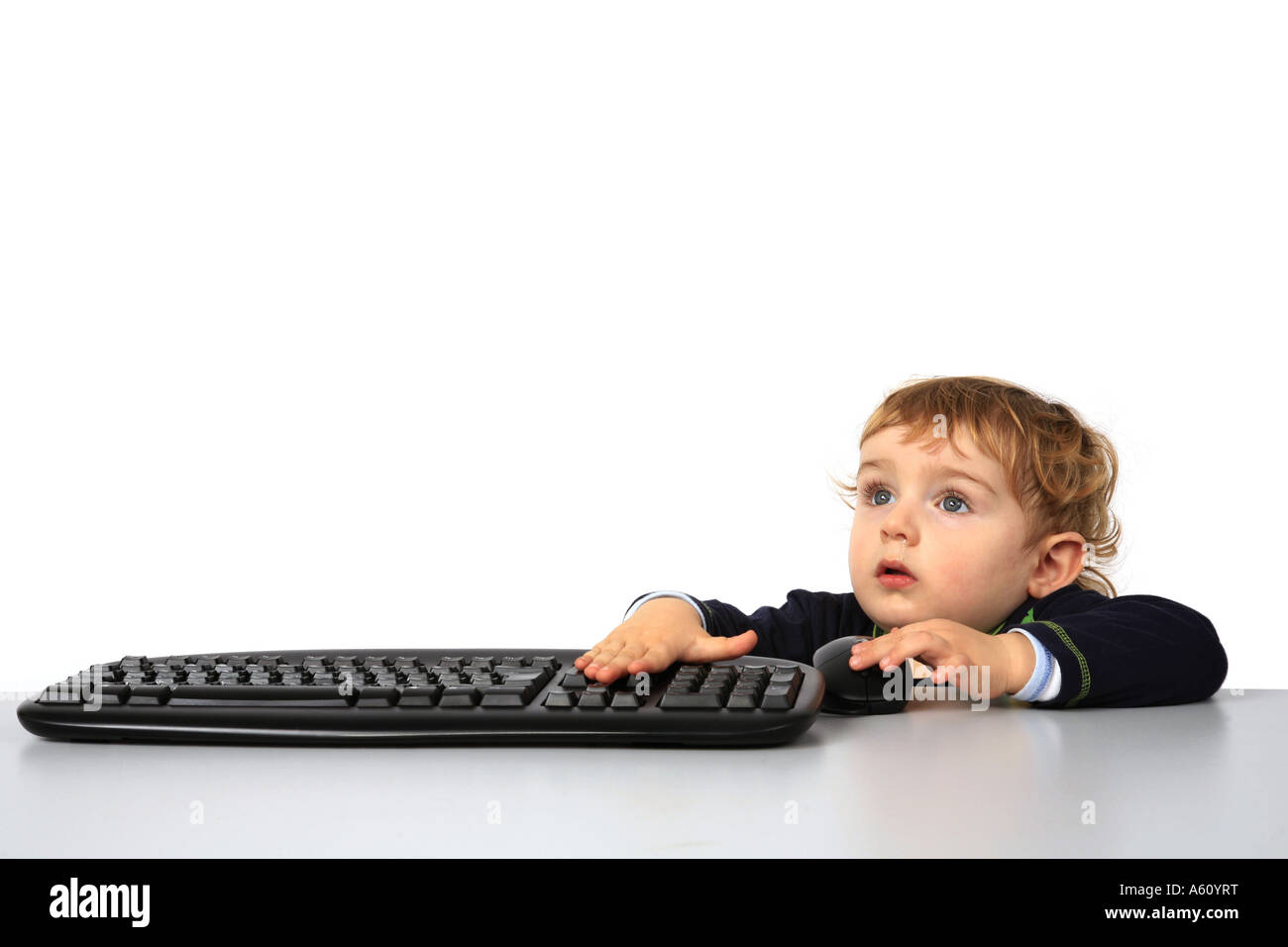 small boy with computer keyboard Stock Photo - Alamy