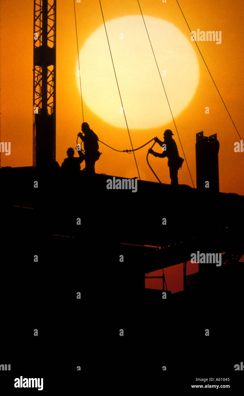 High Steel workers construct office tower under noon sun New York City ...