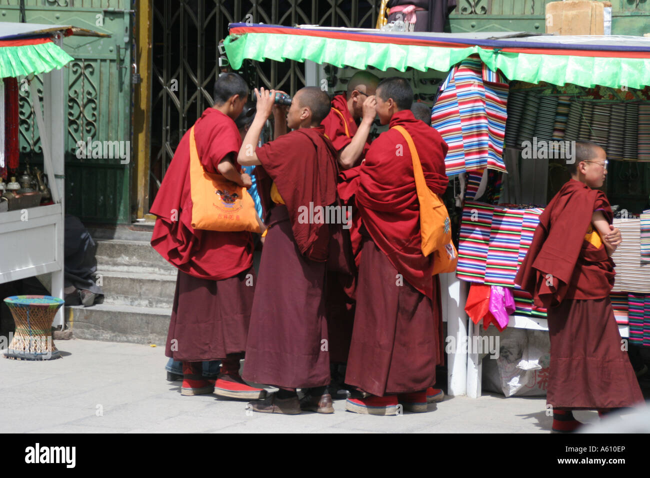 Monks looking through binoculars, Lhasa, Tibet Stock Photo - Alamy