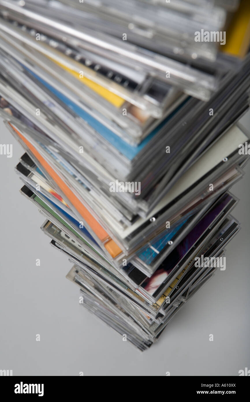 looking down at a very tall stack of cd case on top of each over Stock ...