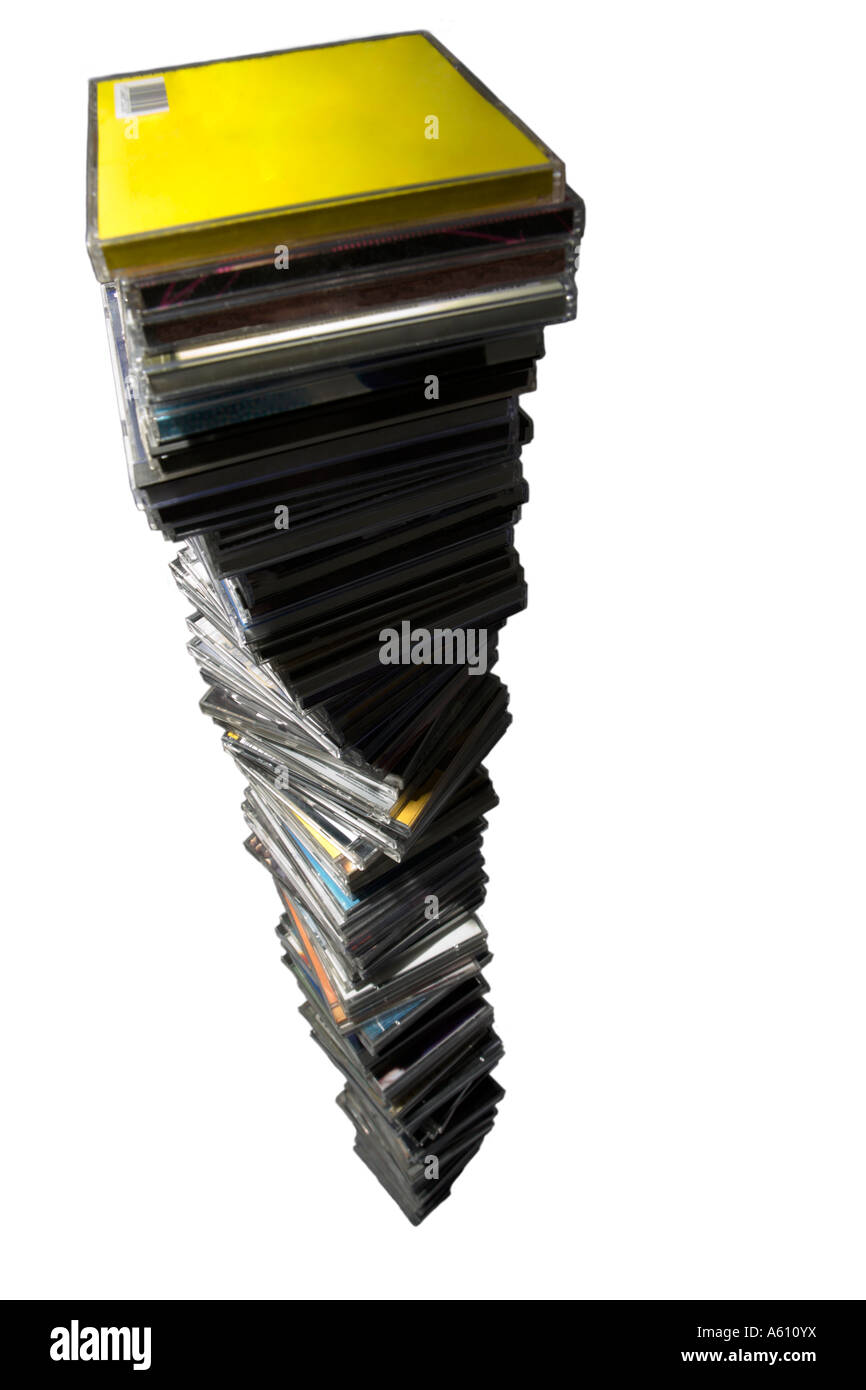 looking down at a very tall stack of cd case on top of each over. three ...