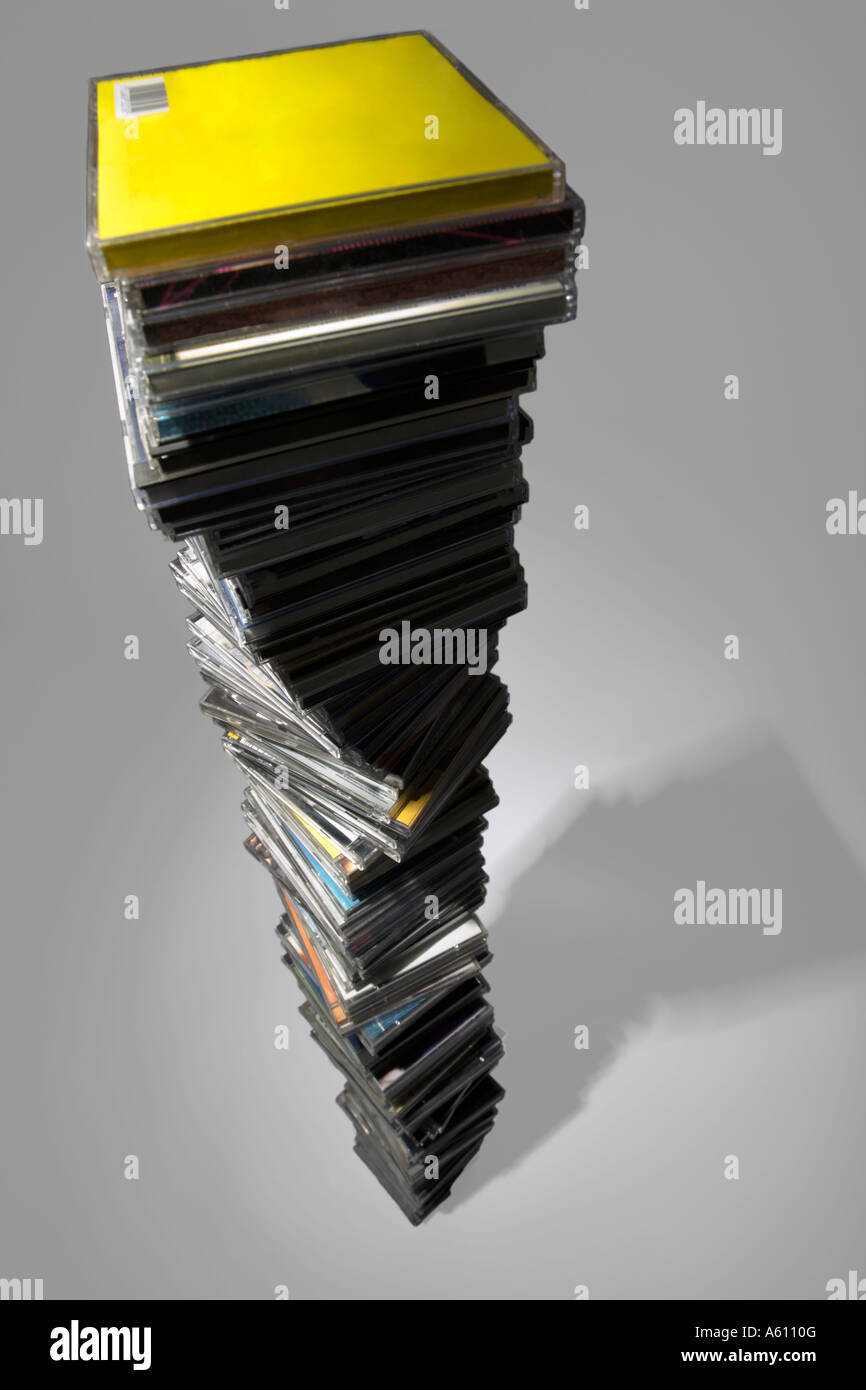 looking down at a very tall stack of cd case on top of each over Stock ...