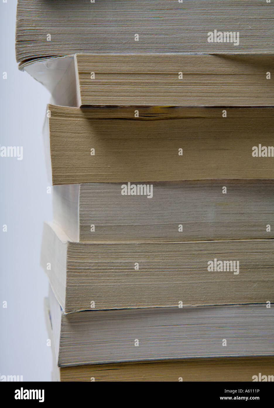 tall stack of paperback books side view Stock Photo - Alamy