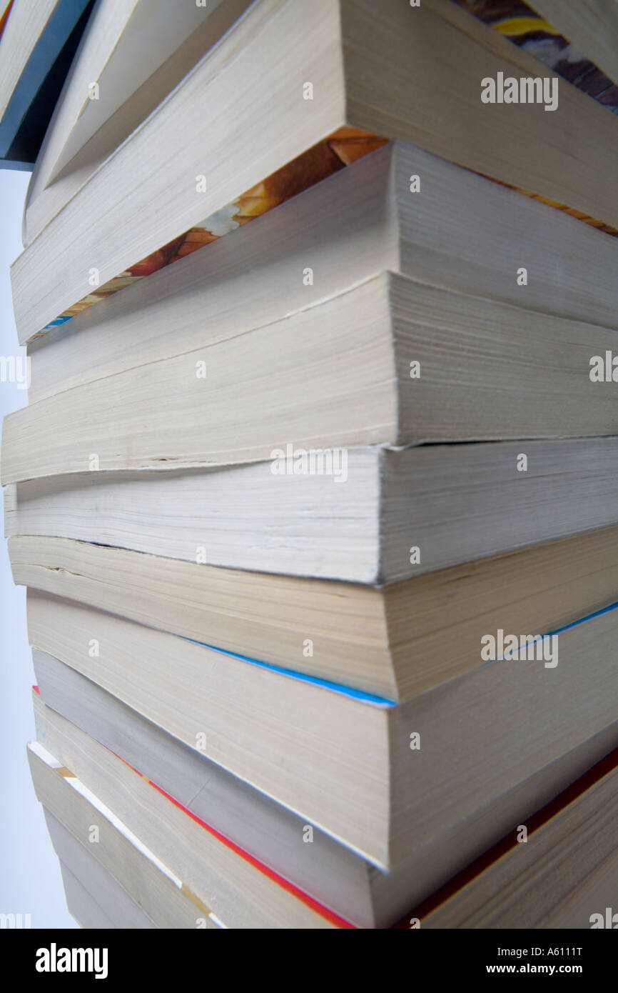 tall stack of paperback books side view Stock Photo - Alamy