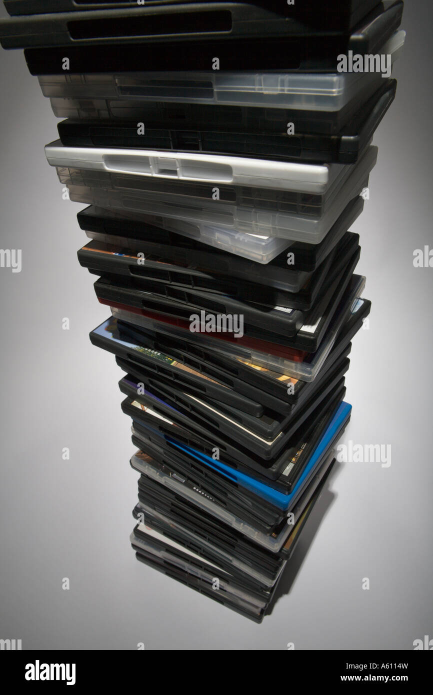 side view of a tall stack of dvd cases with a whit back ground Stock ...