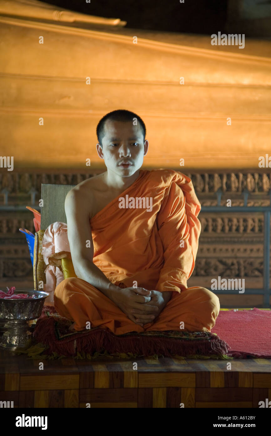 Seated Monk in saffron robes at Wat Sukannakuha or Tiger Temple Krabi ...