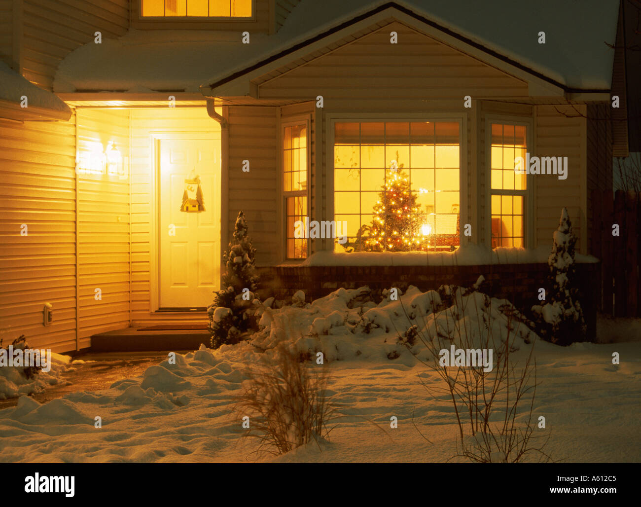 Residential house in snowy winter night Stock Photo - Alamy