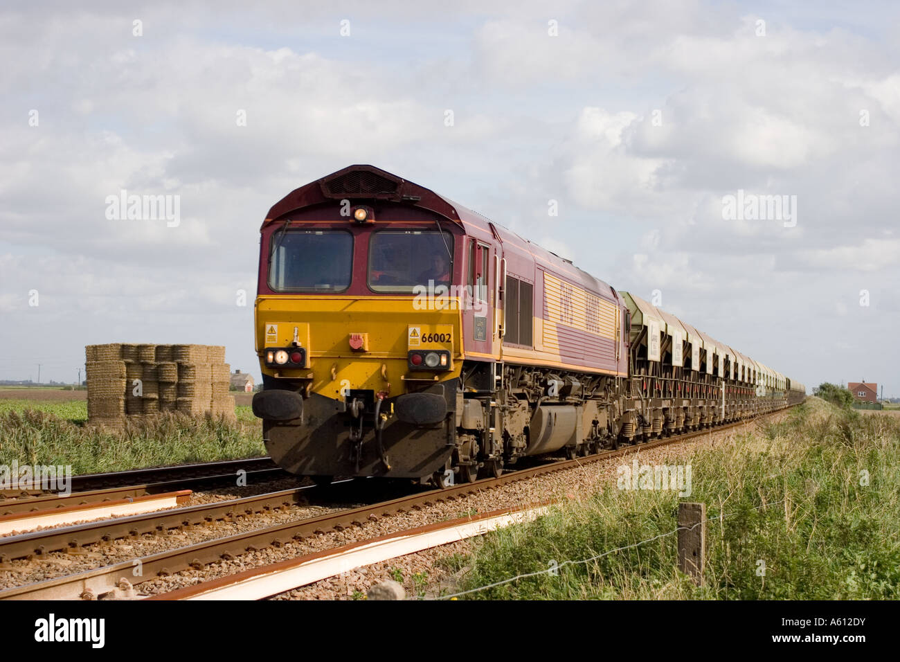 EWS class 66 diesel locomotive No 66002 working an aggregates train at ...