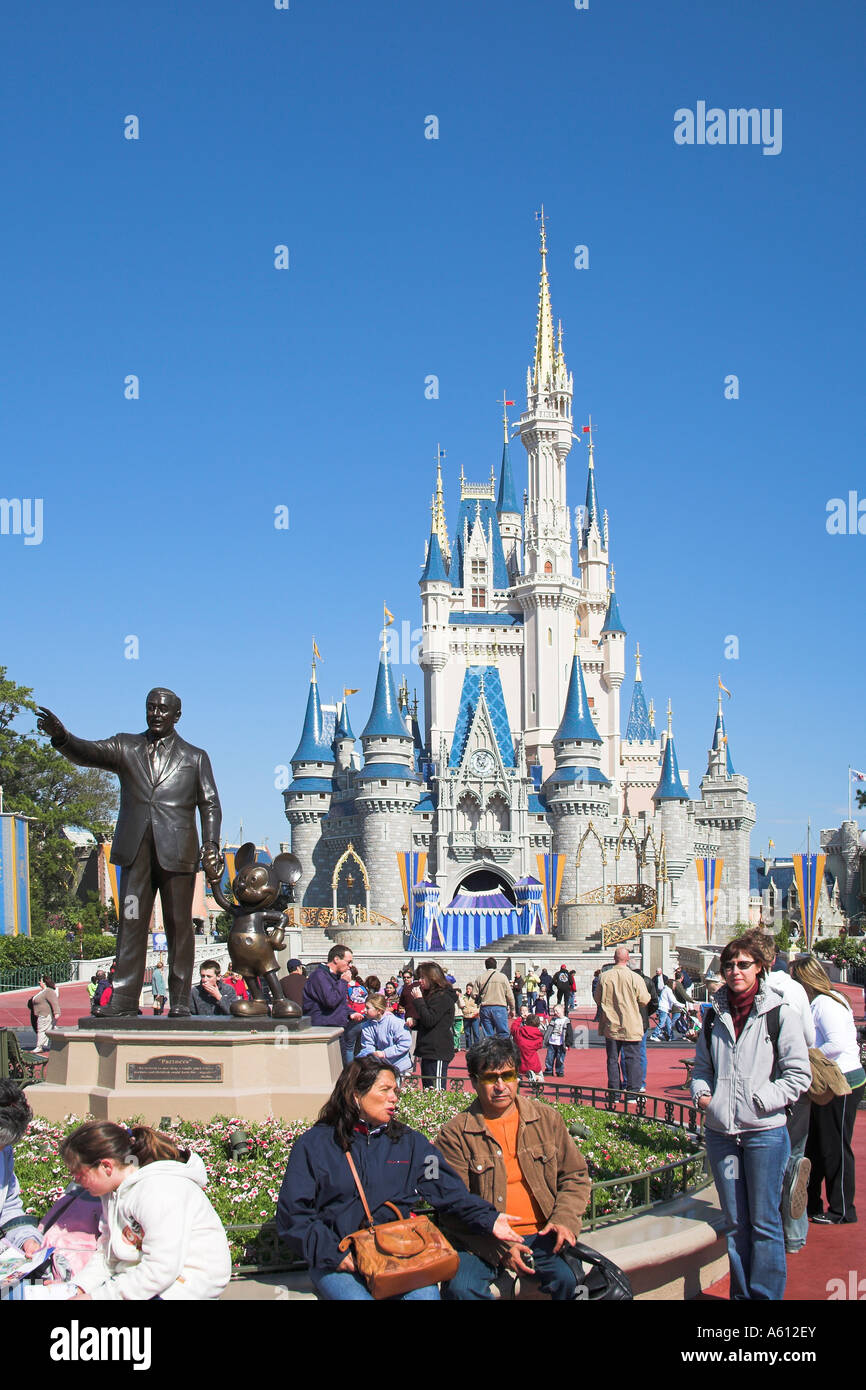 Walt Disney and Mickey Mouse Partners statue and Cinderella Castle ...