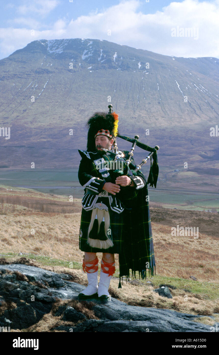Piper in Scottish Highlands Stock Photo - Alamy