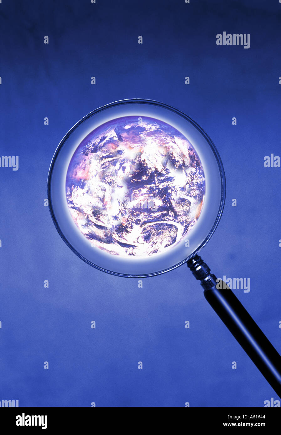 Earth under a magnifying glass Stock Photo - Alamy