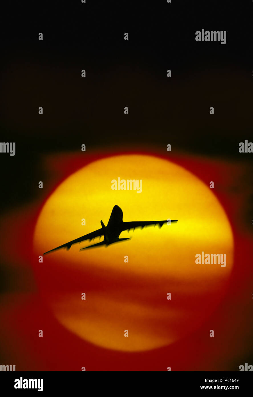 plane flying into sunset Stock Photo - Alamy
