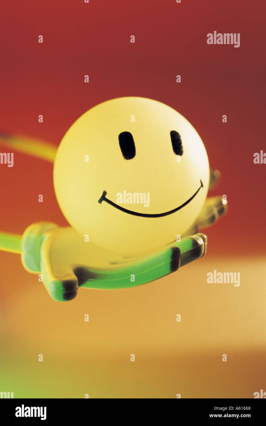 Toy Hands Holding Smiley Stock Photo - Alamy