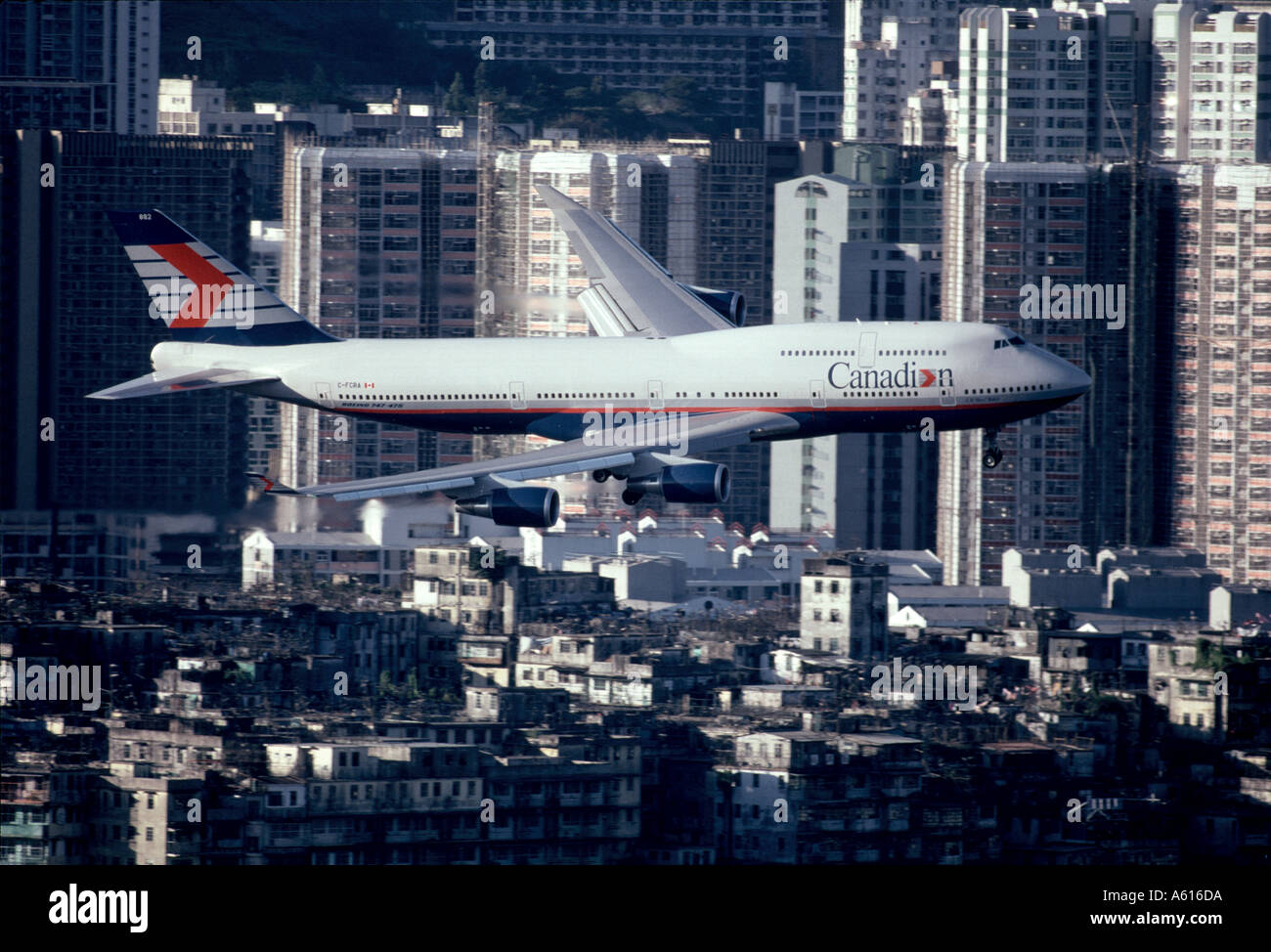 Aircraft landing in Hong Kong Stock Photo - Alamy