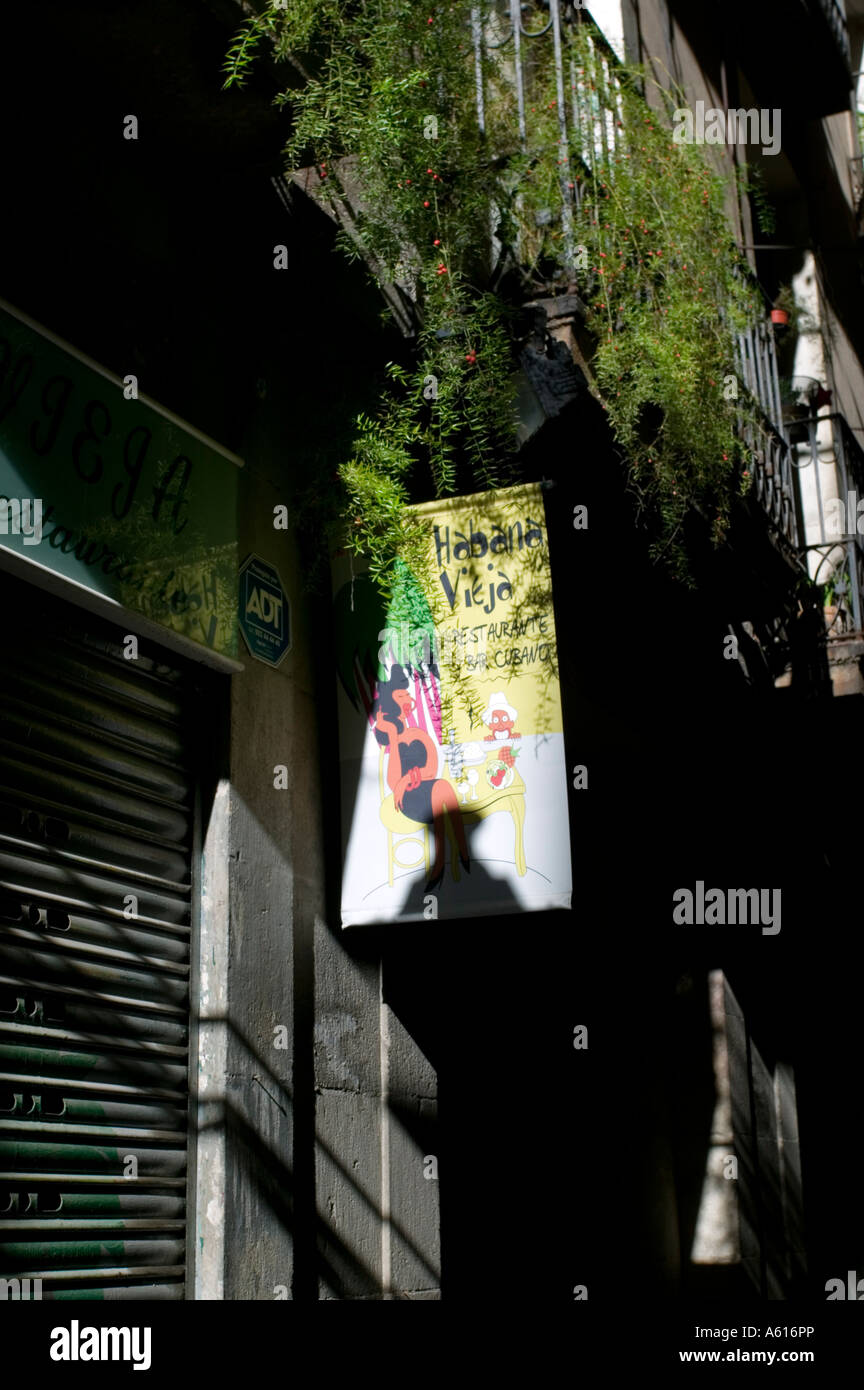 Colourful restaurant sign hanging below balcony Born district La Ribera ...