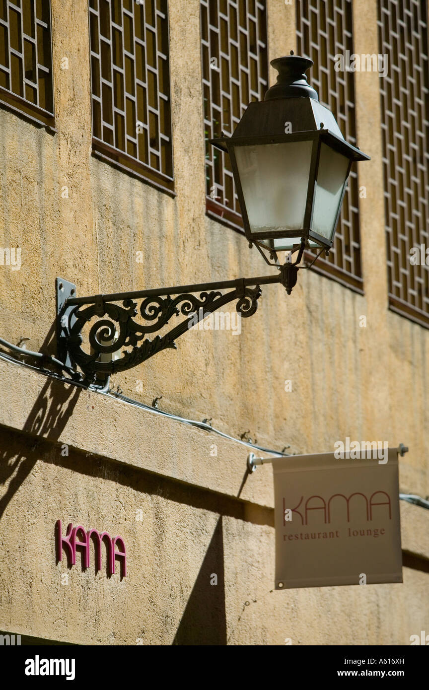 Street light and shop signs in brilliant sunshine Born district La ...