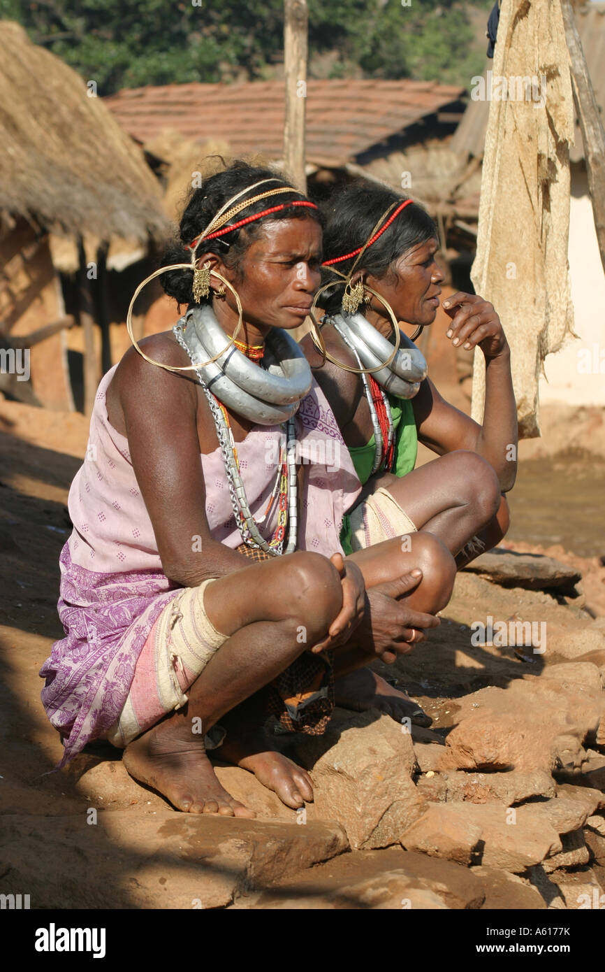 Two Gadaba tribal women squatting in their village Koraput Distict ...