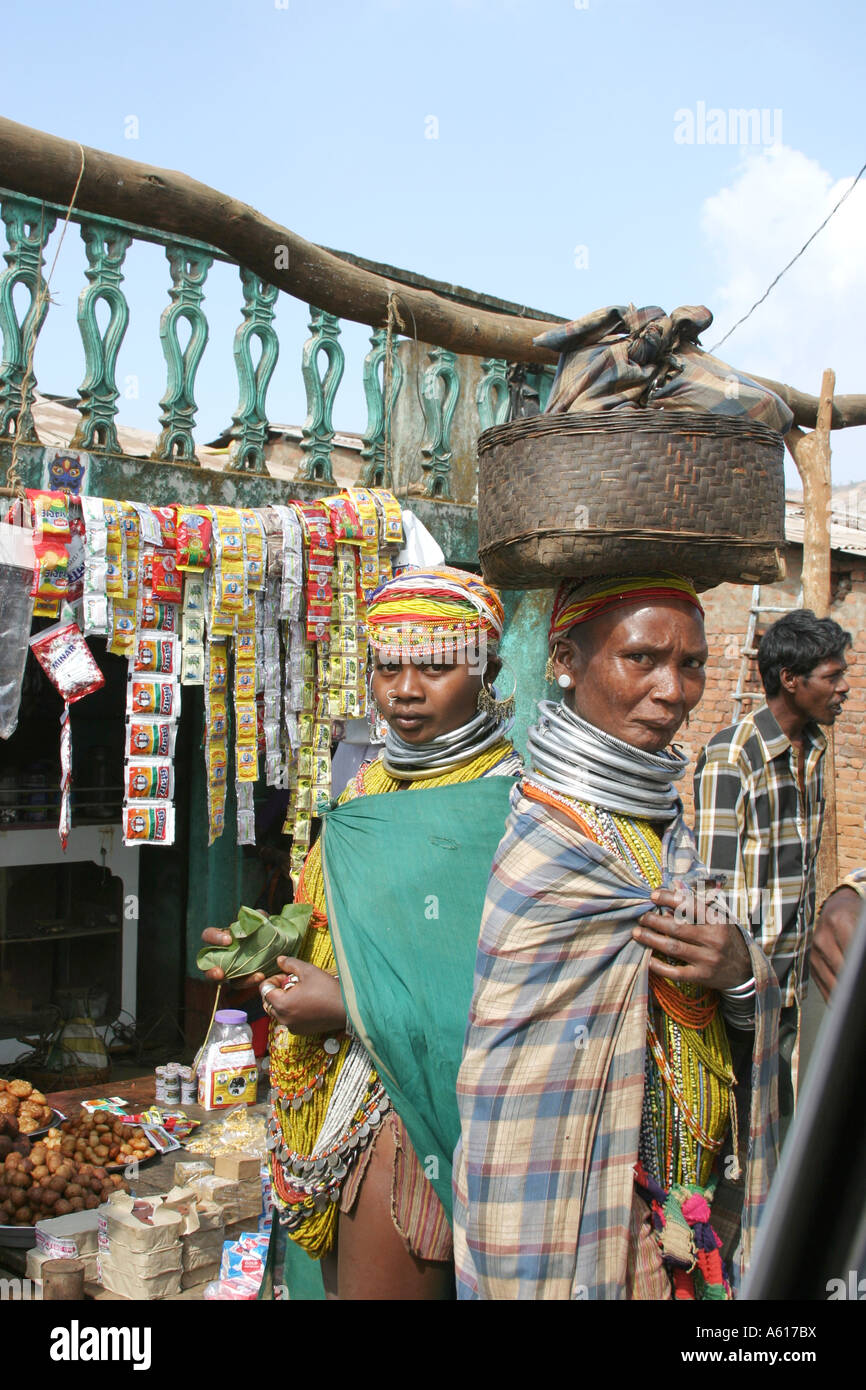 Gadaba tribal woman balancing a basket on her head at a weekly market ...