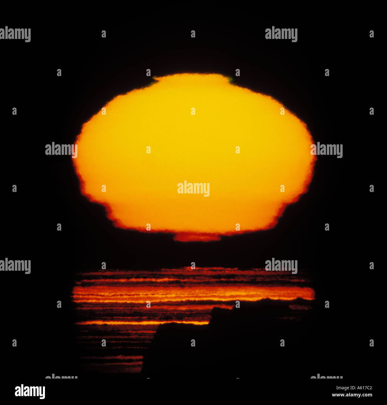 Sun setting over the Baffin Bay with green flash showing on the upper ...