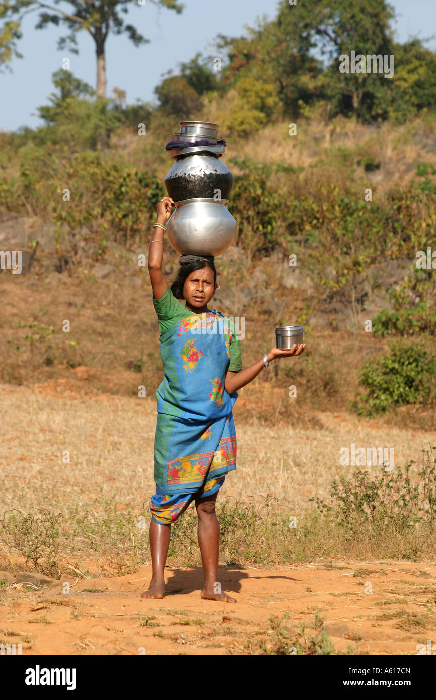 Indian woman balancing pots hi-res stock photography and images - Alamy