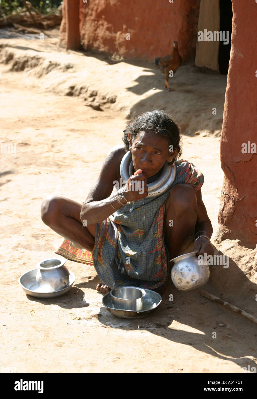 Gadaba tribal woman washing pots .Orissa India Stock Photo - Alamy