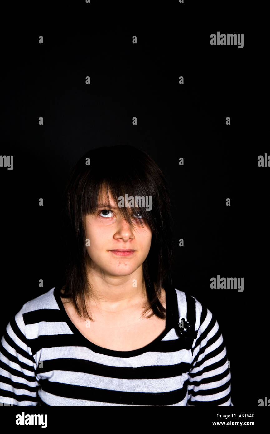 Young girl aged 13 with lukewarm face looks upwards Stock Photo - Alamy