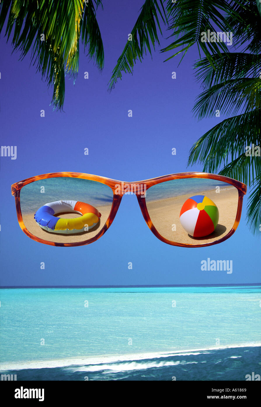 sunglasses with beach ball inflatable swimming ring reflections on ...