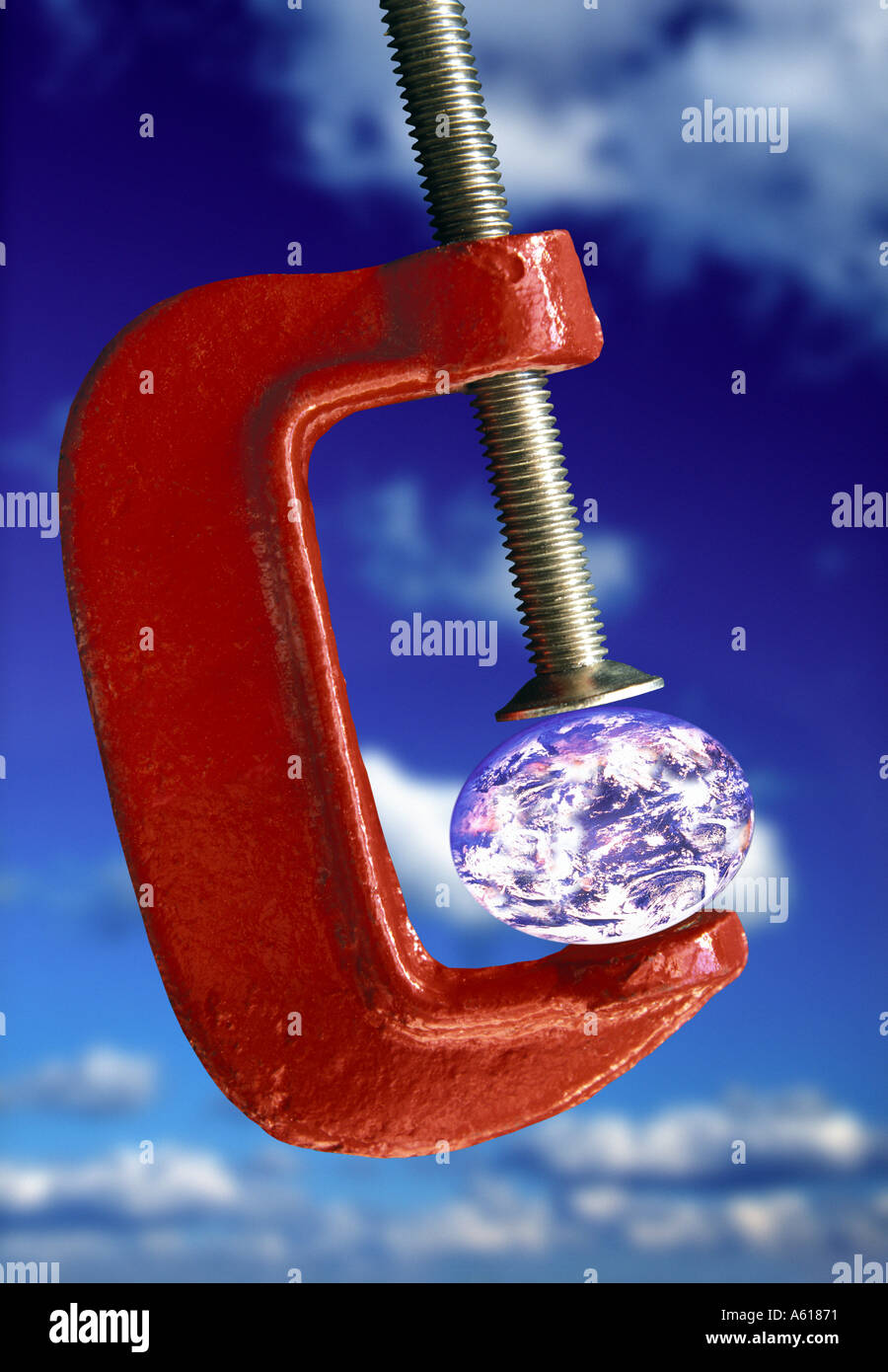 Earth under pressure in clamp Stock Photo - Alamy