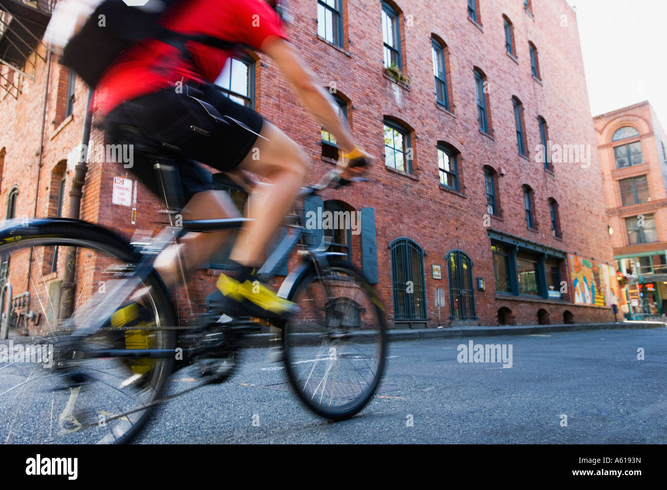 Low angle shot man cycling hi-res stock photography and images - Alamy