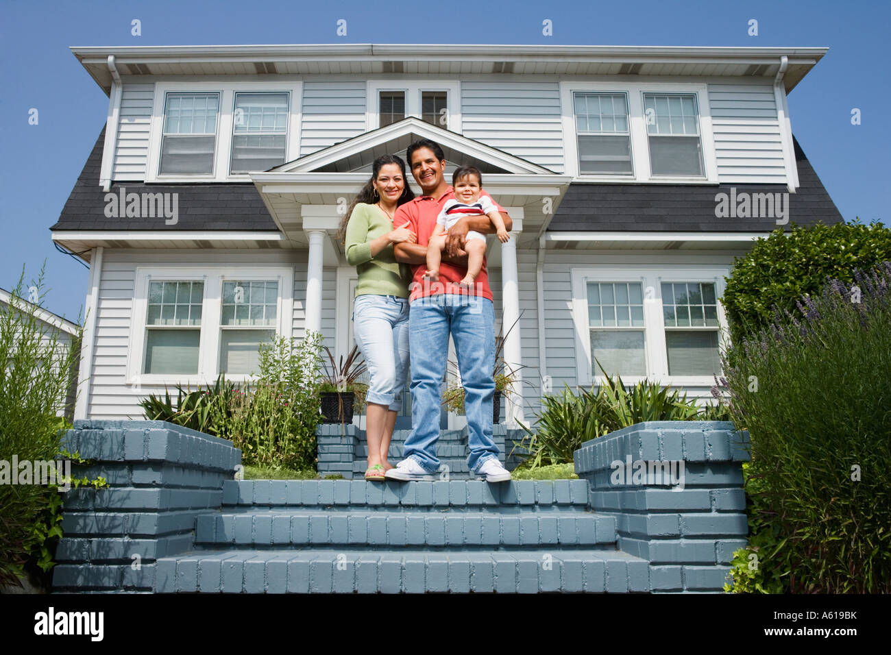 Portrait of Hispanic family in front of house Stock Photo - Alamy