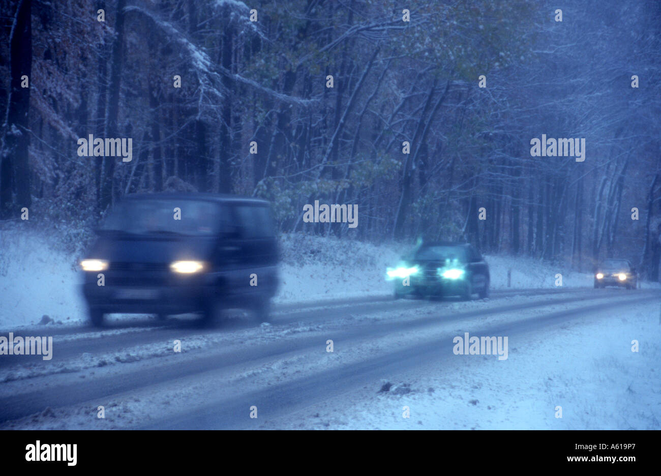 Cars on snowy street, Germany Stock Photo - Alamy
