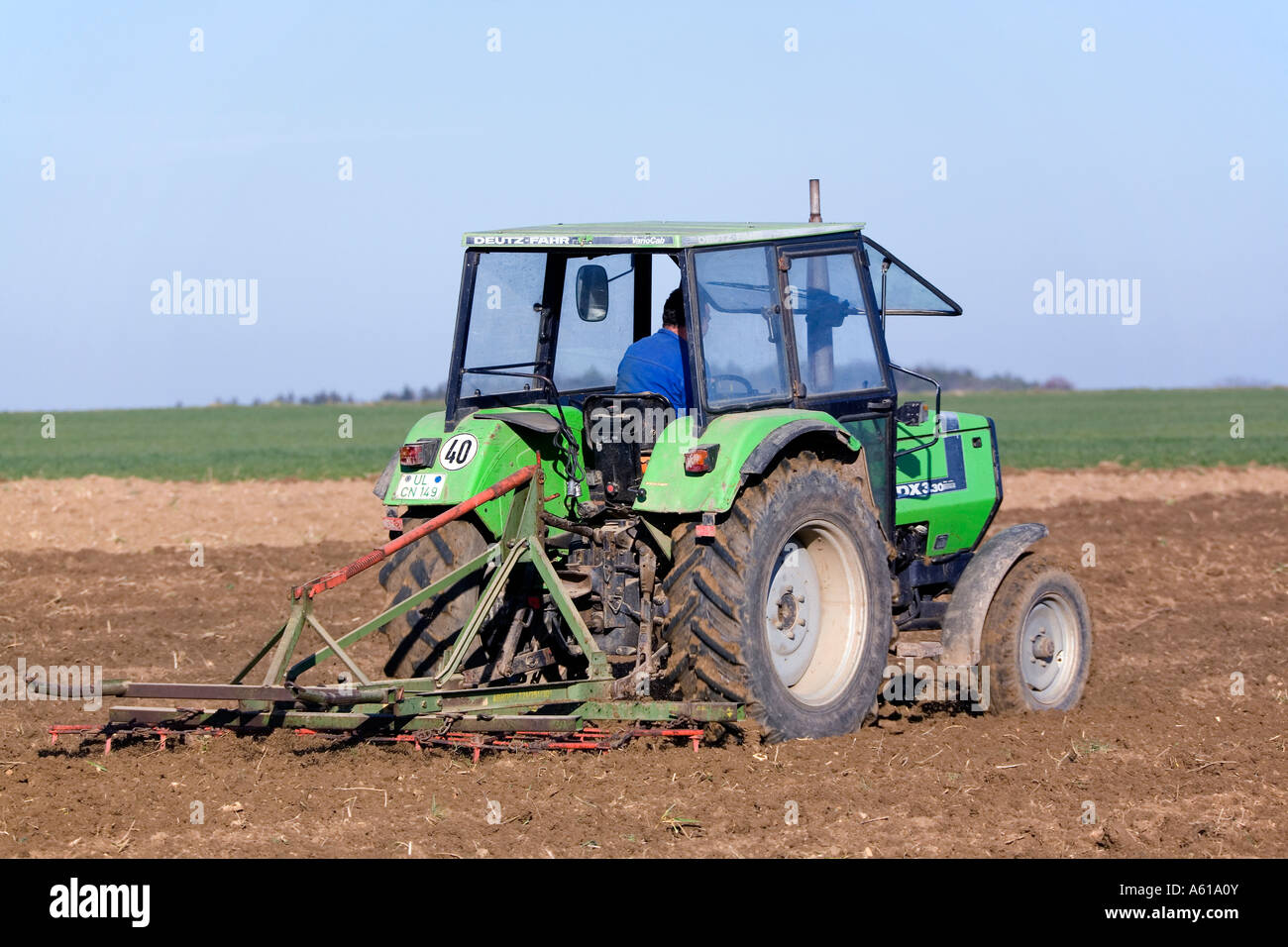 Farm work in spring Stock Photo - Alamy
