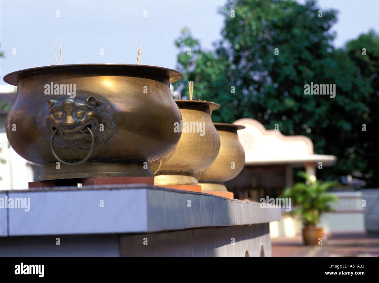 Brass urn outside a buddhist temple Stock Photo - Alamy