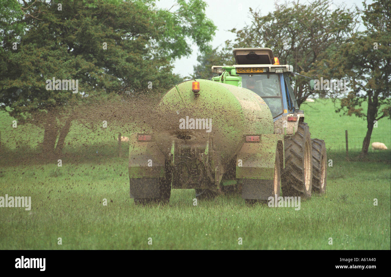 Tractor and vacuum tanker spreading slurry Stock Photo - Alamy