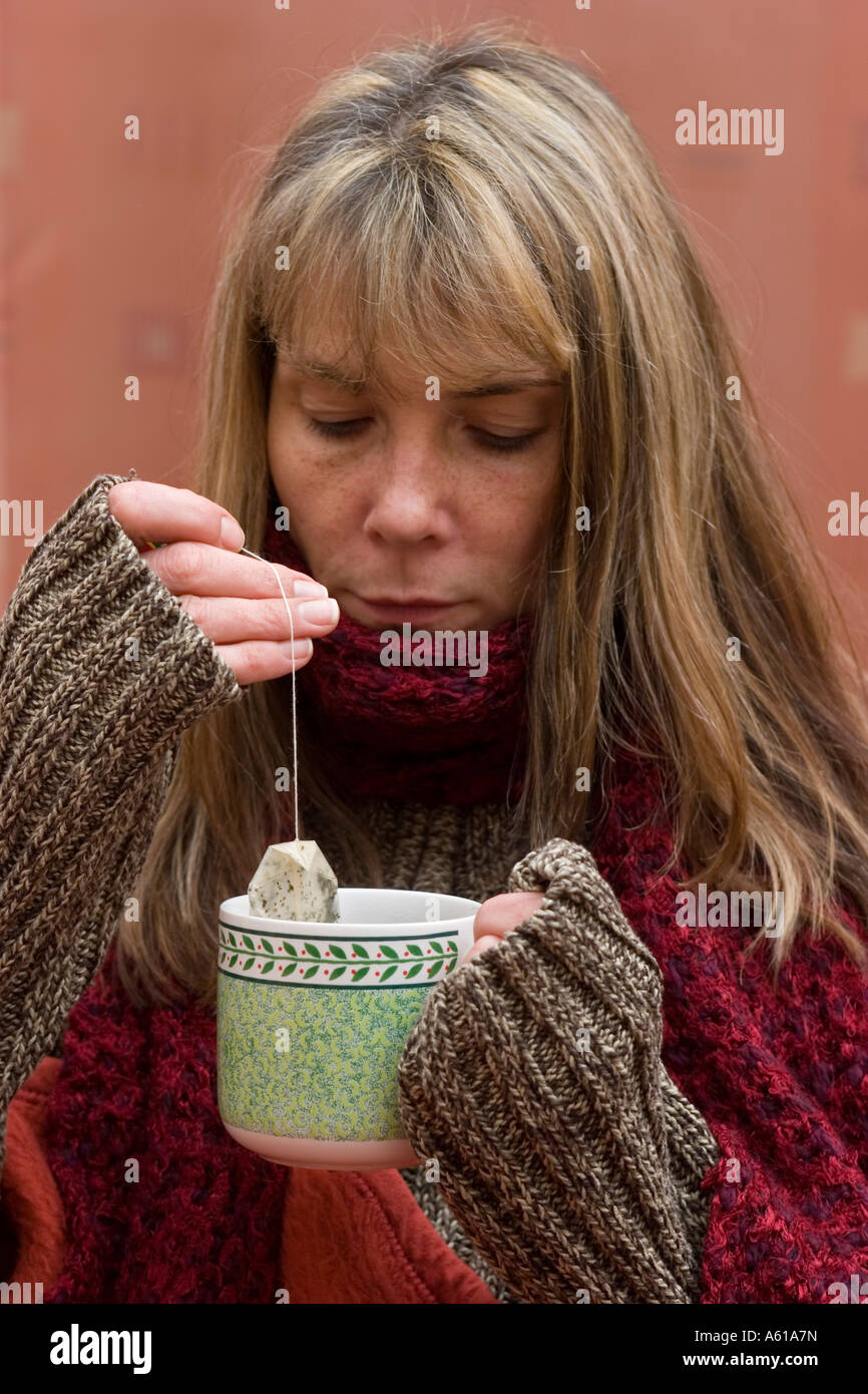 Woman taking tea bag hi-res stock photography and images - Alamy
