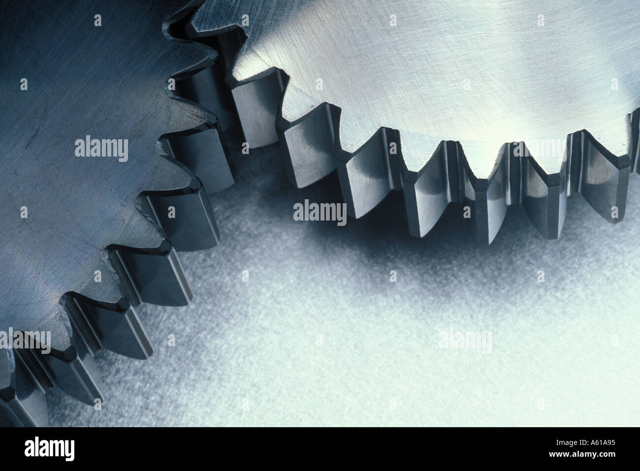 Synchronized gears connected Stock Photo - Alamy